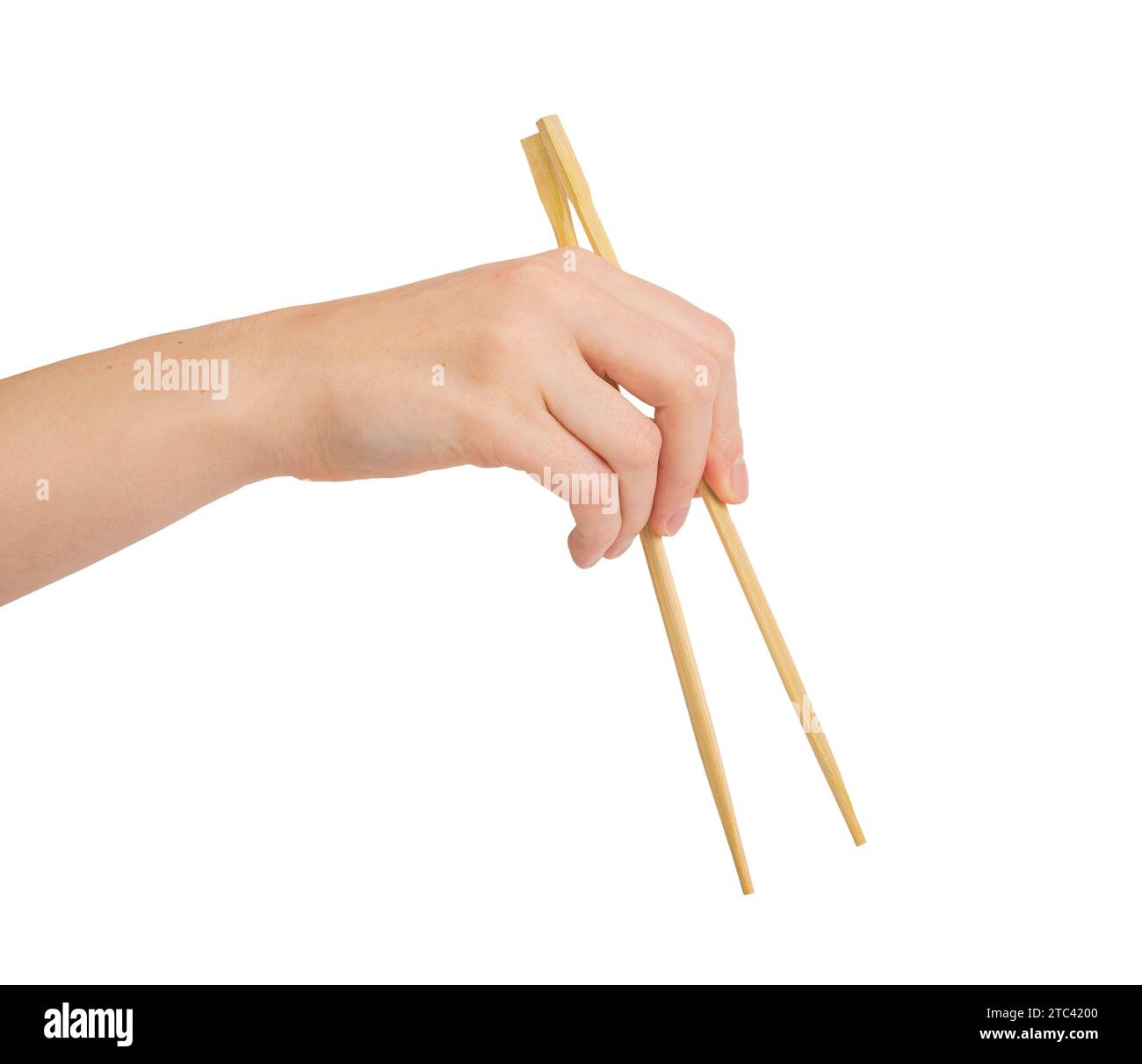 Hand holding wooden chopsticks, Chinese food sticks isolated on white ...