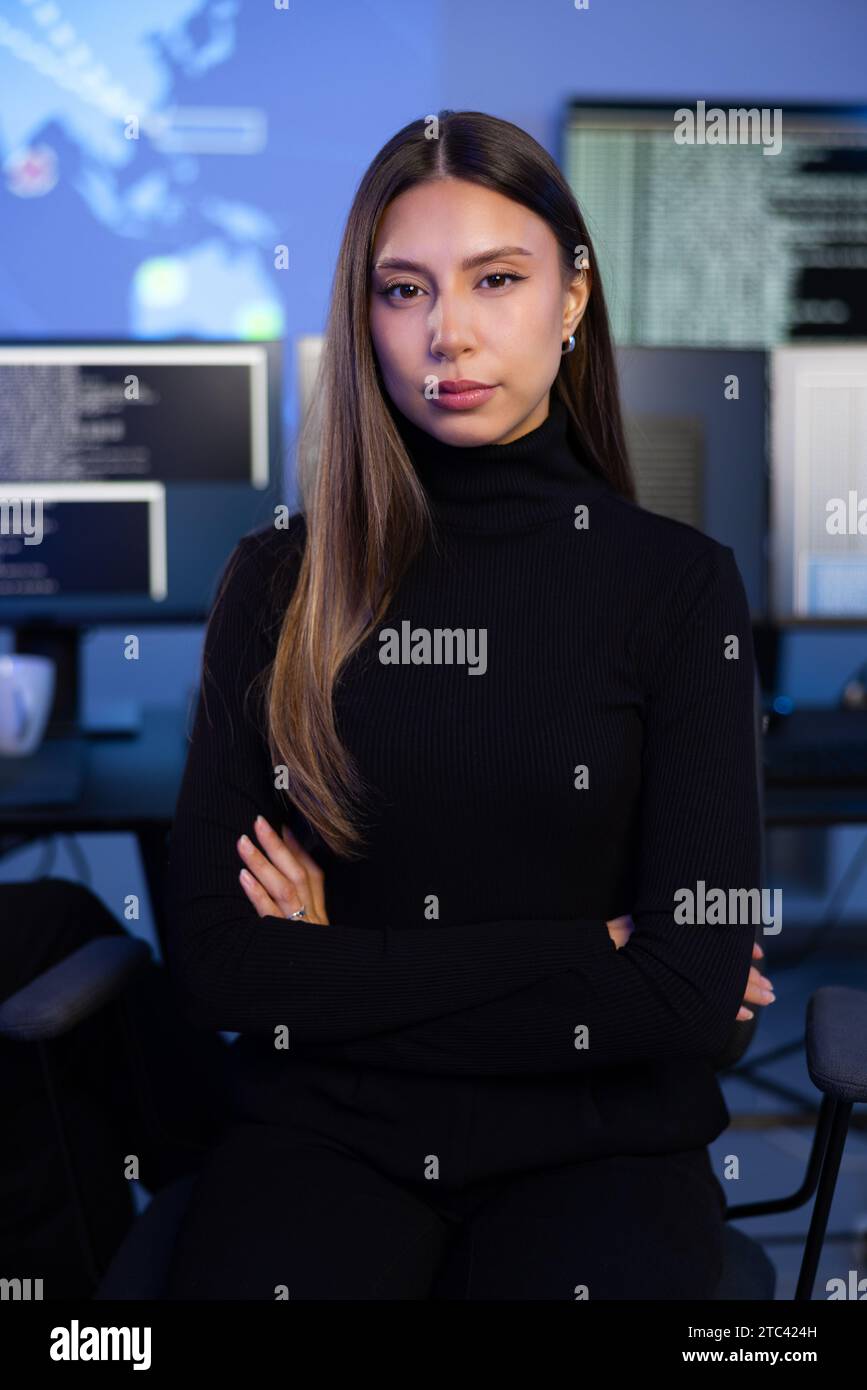 Confident Female Cybersecurity Analyst Or Manager In Large Cyber Security Operations Center Soc