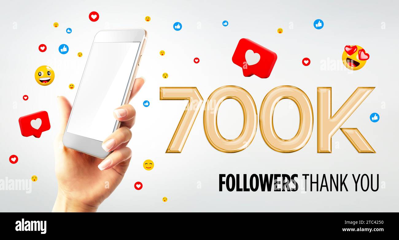 700k followers celebration. Hand holding mobile smartphone with blank ...