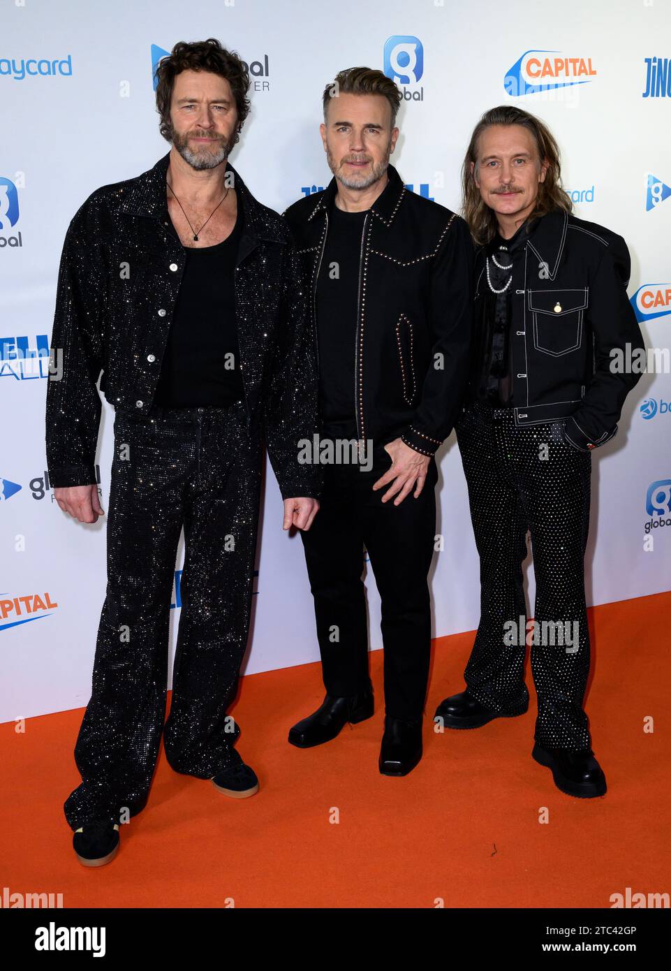 London, UK. December 10th, 2023. Howard Donald, Gary Barlow and Mark ...