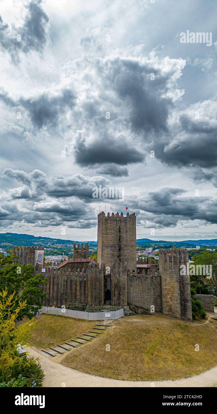 A grand, imposing castle stands in the middle of an open field ...