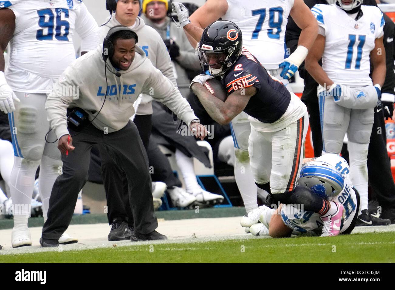 Chicago Bears wide receiver DJ Moore advances a pass from quarterback Justin Fields as Detroit ...