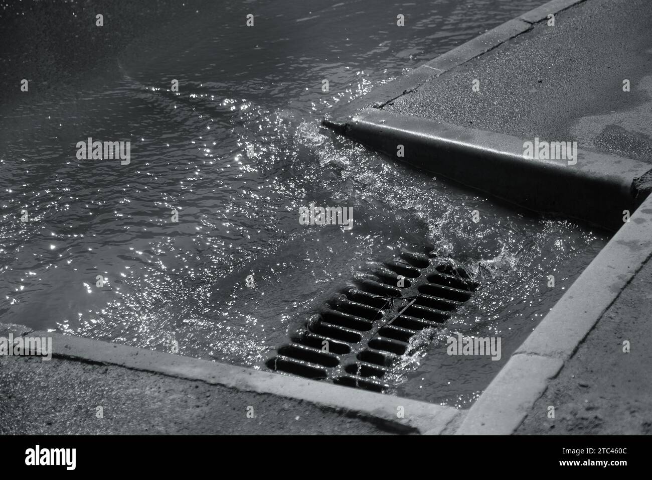Flow of water during heavy rain and clogging of street sewage. The flow ...