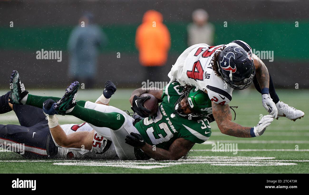 New York Jets running back Dalvin Cook (33) is tackled by Houston ...