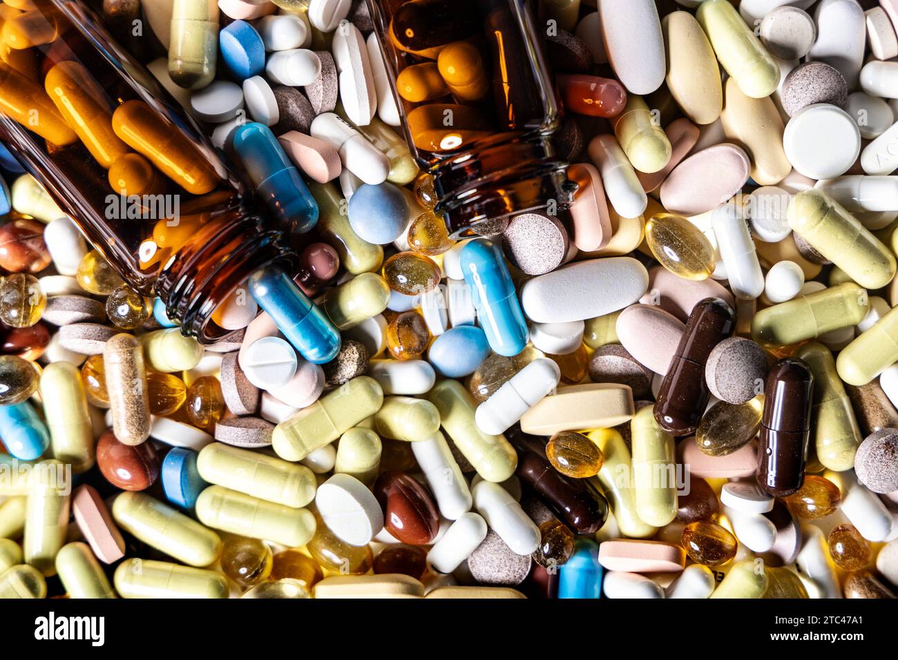 Pills, capsules and tablets with pill bottles background Stock Photo ...