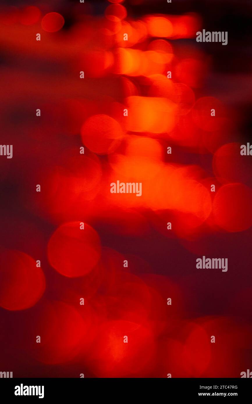 Red out of focus specular highlights created by a setting sun ...