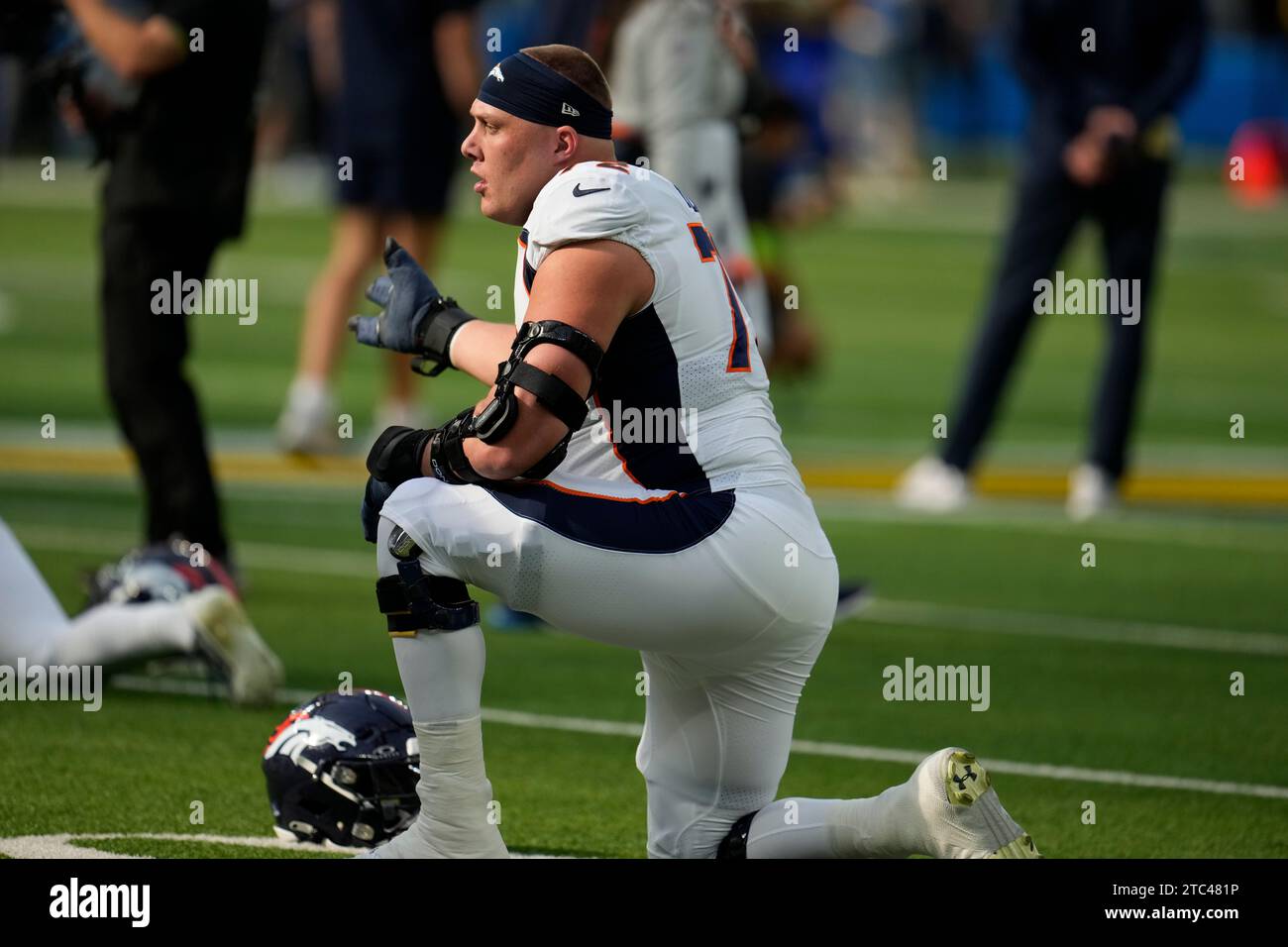 Denver Broncos offensive tackle Garett Bolles kneels on the field ...