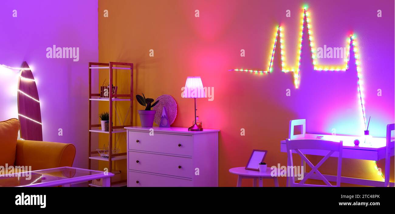 Interior of modern living room with neon lighting Stock Photo - Alamy