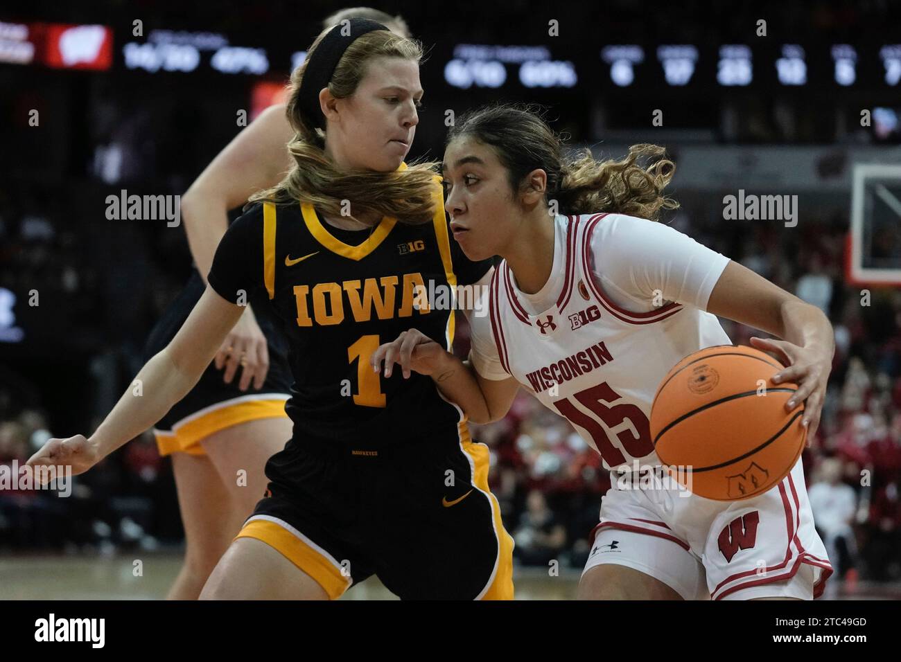 Wisconsin's Sania Copeland tries to get past Iowa's Molly Davis during ...