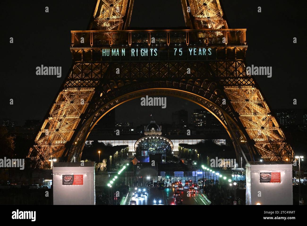 Paris, France. 10th Dec, 2023. The Eiffel tower with a band " Humans ...