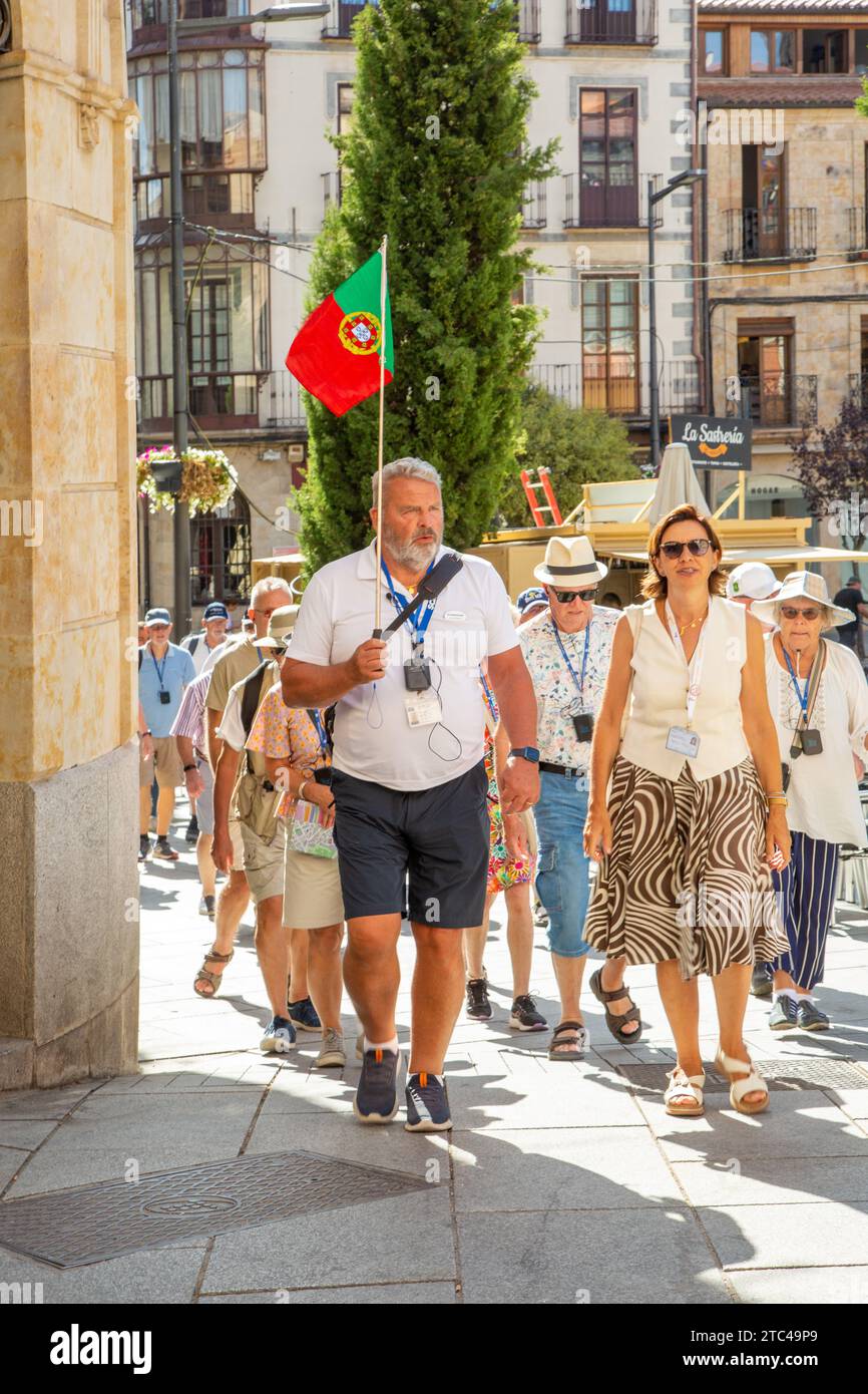Tourists on a guided walking tour in the Spanish city of Salamanca ...