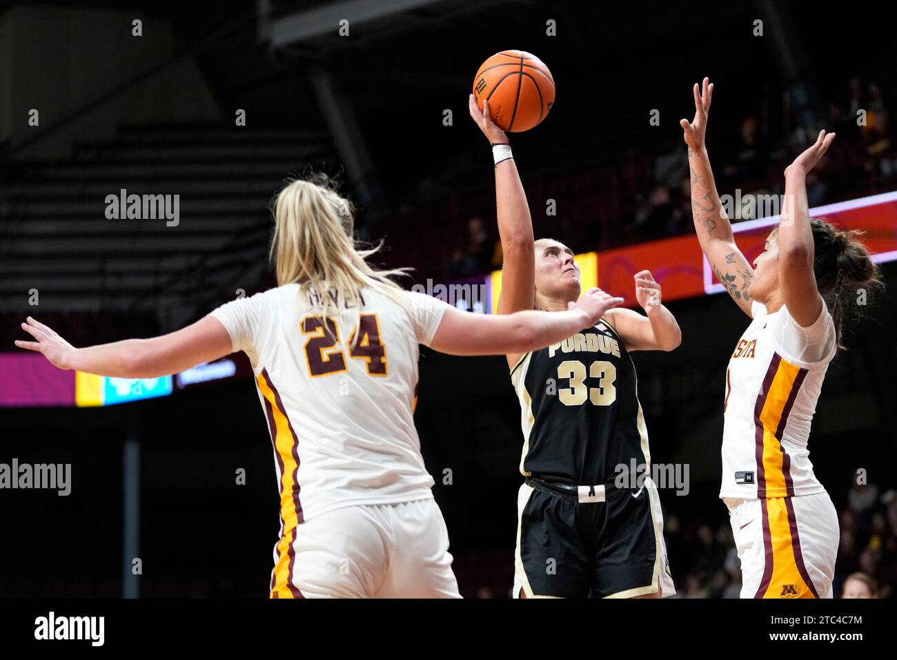 Purdue guard Madison Layden (33) attempts a shot as Minnesota forward ...
