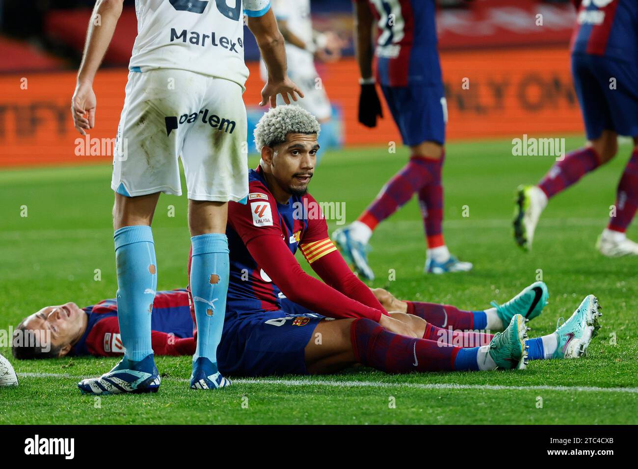 Barcelona's Ronald Araujo, right, and Robert Lewandowski, left, react ...