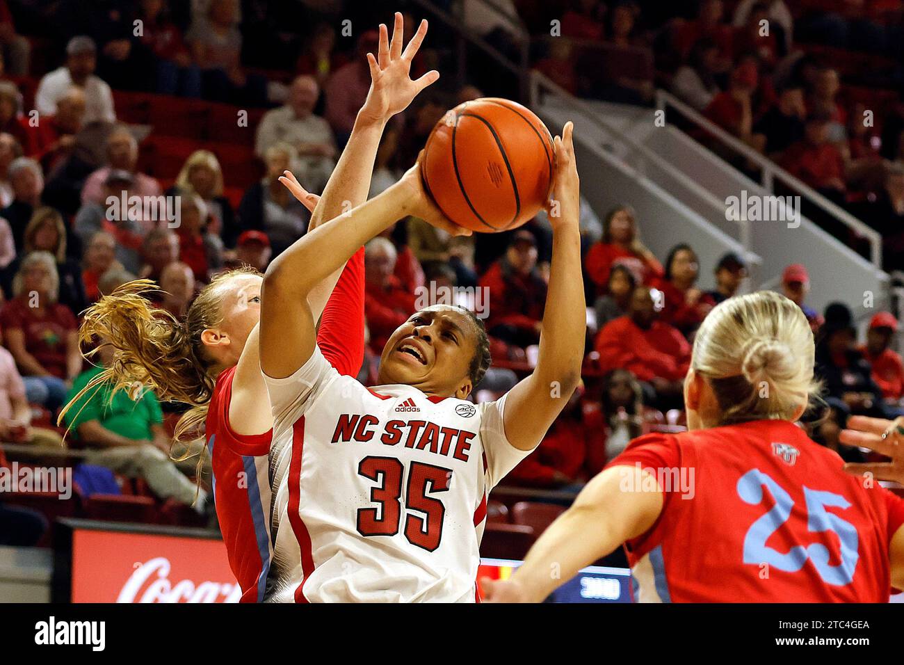 North Carolina State's Zoe Brooks (35) grabs a rebound away from ...
