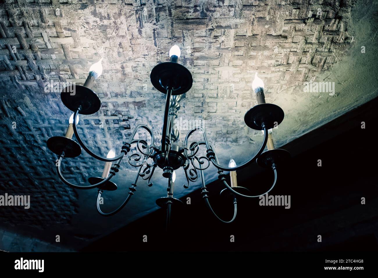 Old and ancient roof lamp with candles on a ruined ceiling Stock Photo ...