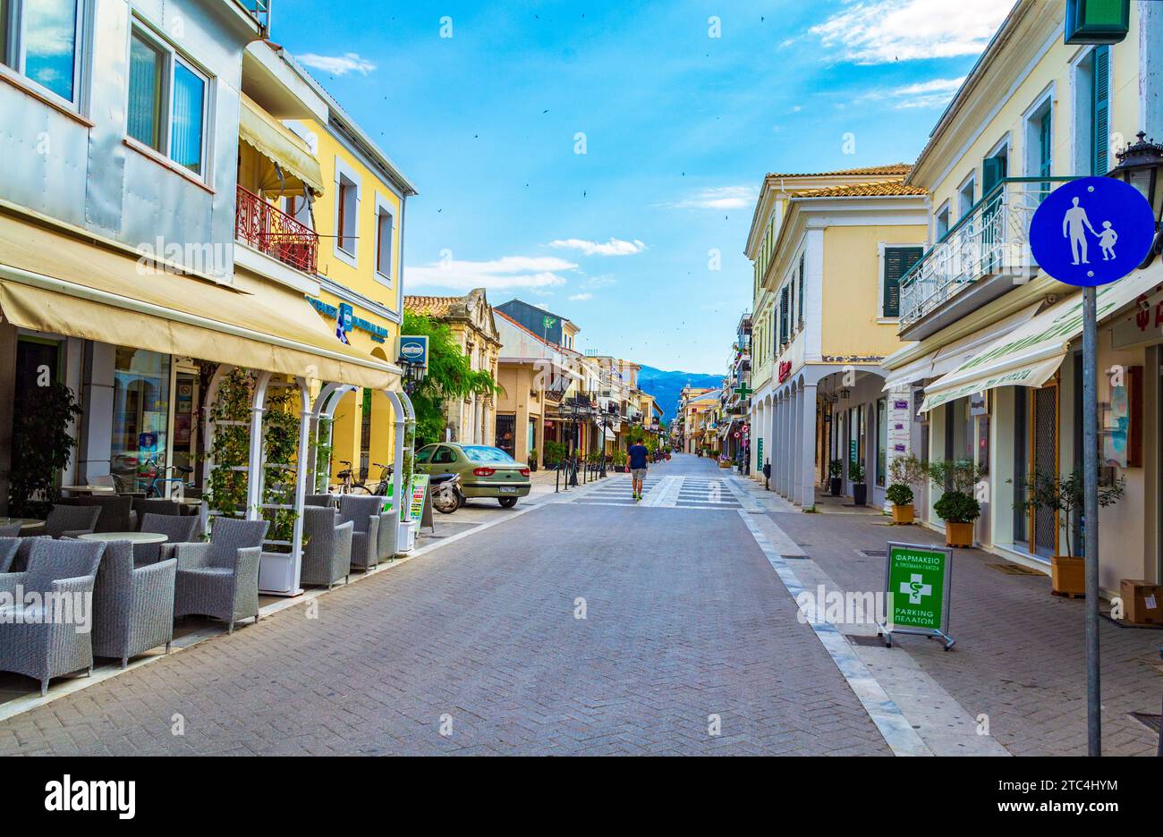 Lefkada town main commercial street Greece. Colorful houses,stores and ...