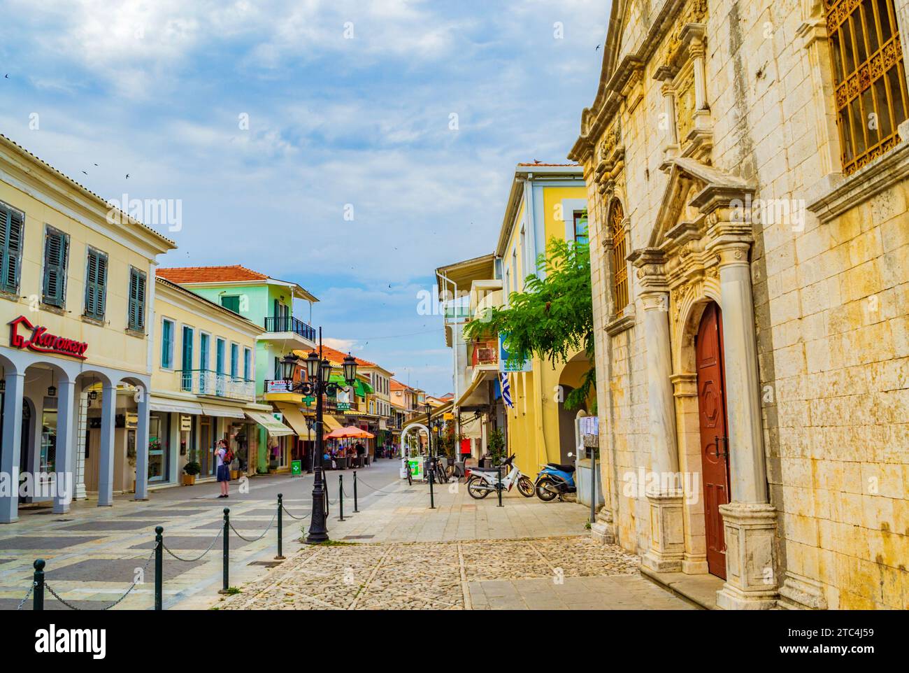Lefkada town main commercial street Greece. Colorful houses,stores and ...