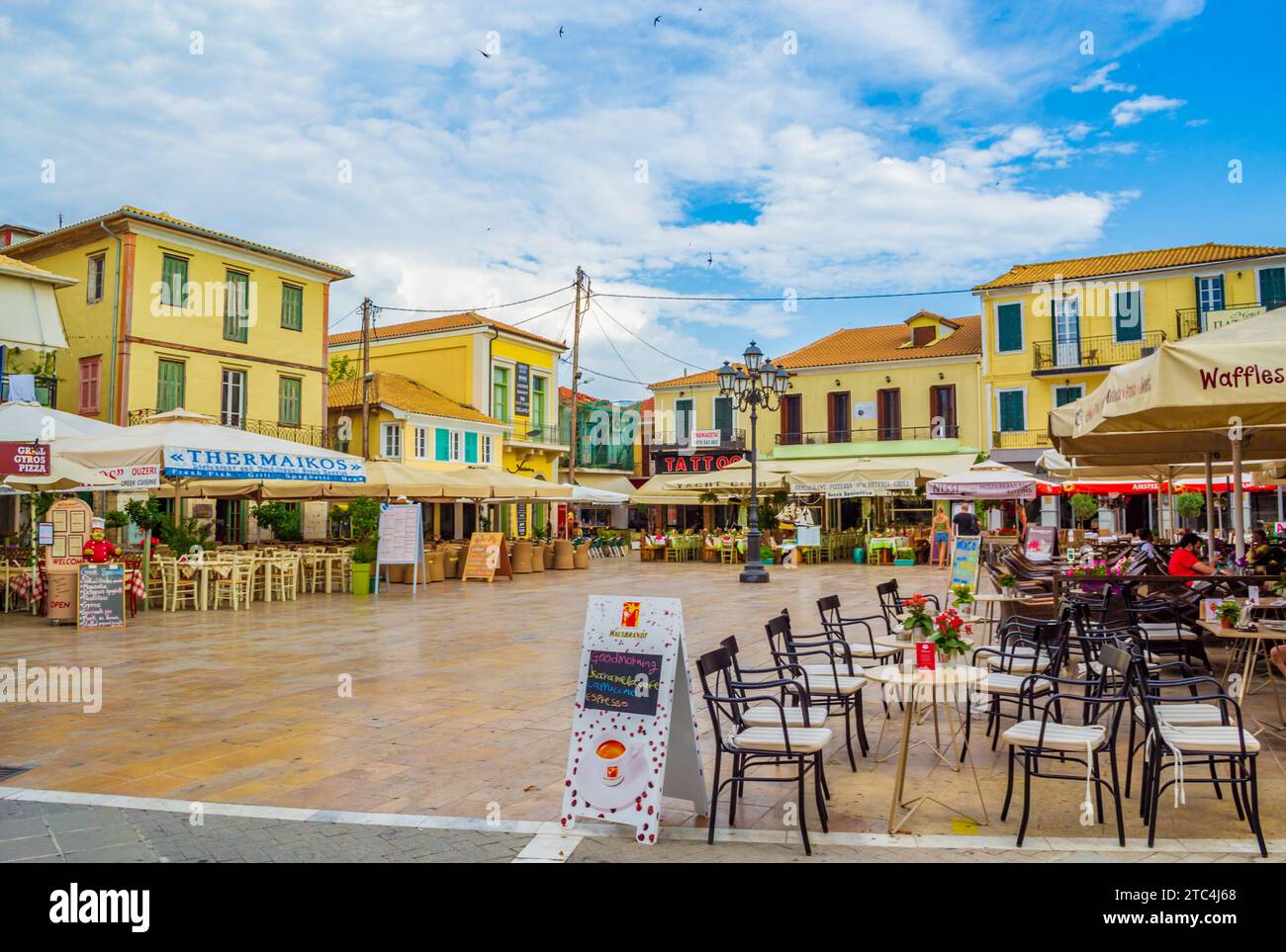 Lefkada town main commercial street Greece. Colorful houses,stores and ...