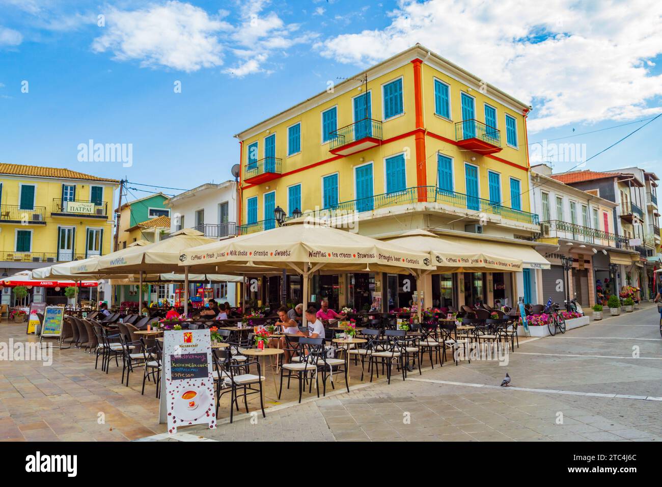 Lefkada town main commercial street Greece. Colorful houses,stores and ...