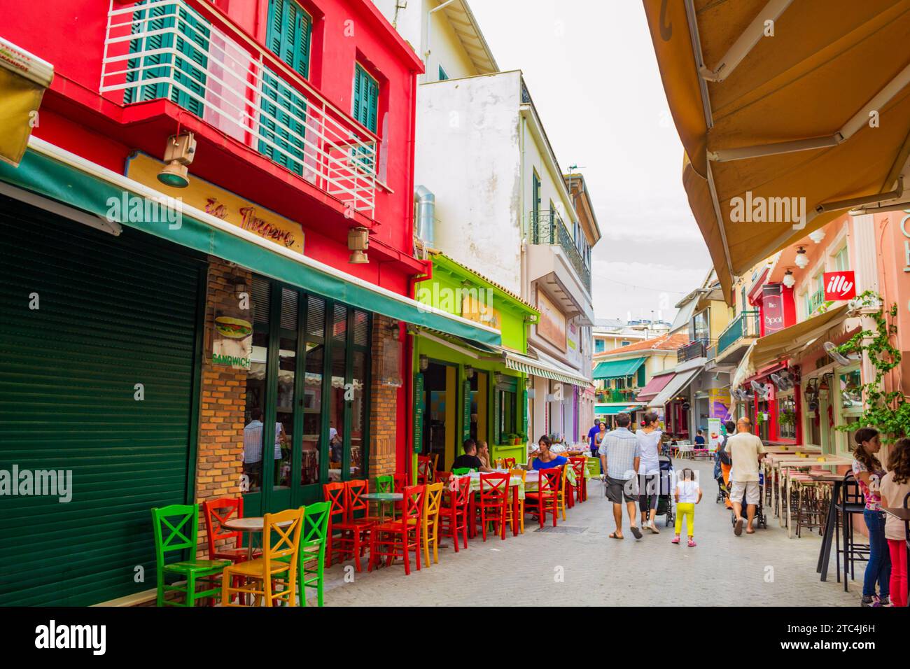 Lefkada town main commercial street Greece. Colorful houses,stores and ...