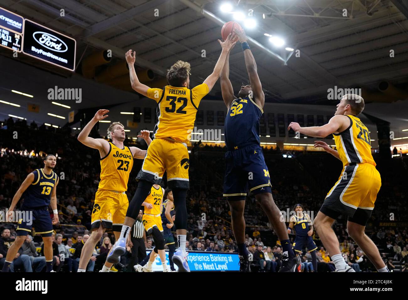 Michigan forward Tarris Reed Jr. shoots over Iowa forward Owen Freeman ...