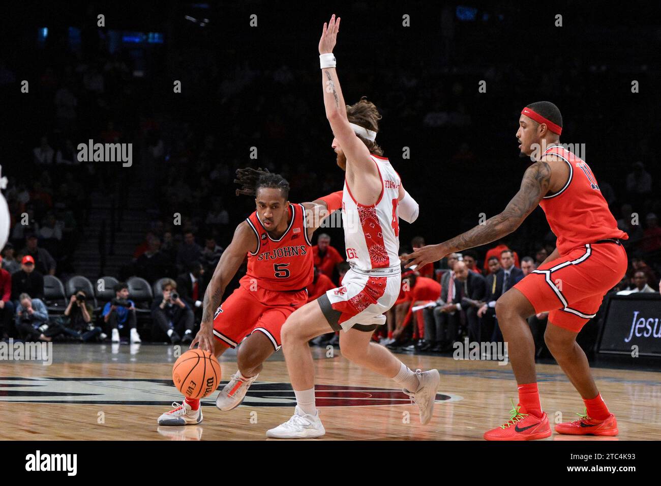 St. John's guard Daniss Jenkins (5) drives to the basket as Boston ...