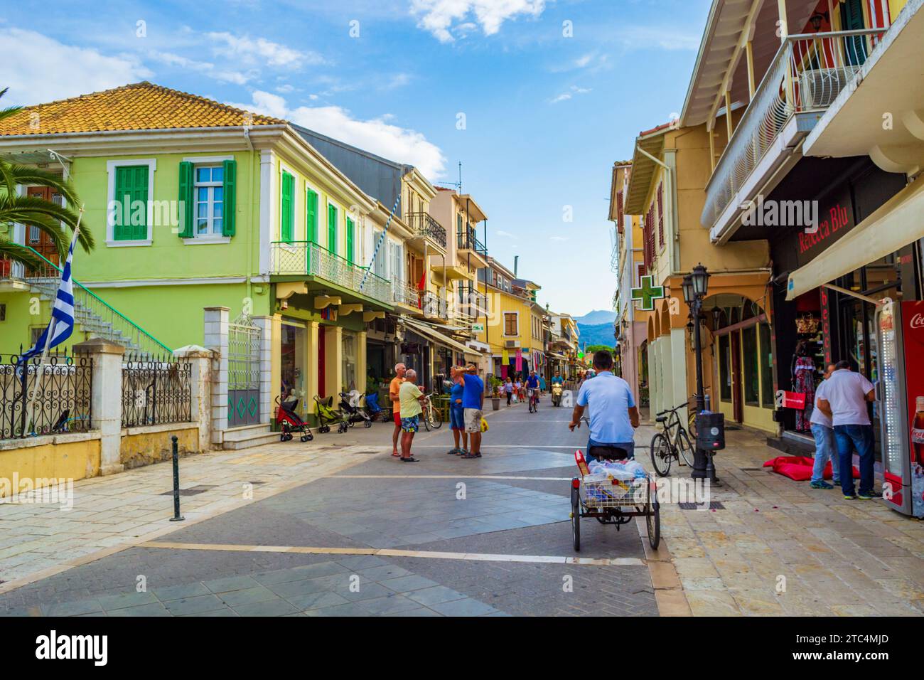 Lefkada town main commercial street Greece. Colorful houses,stores and ...