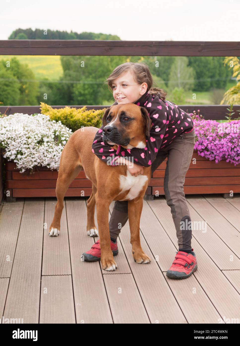 girl cuddle big dog Stock Photo - Alamy