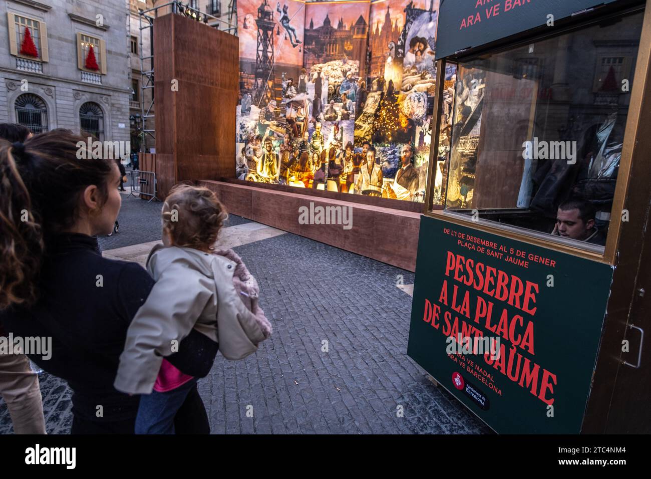 Barcelona, Catalonia, Spain. 10th Dec, 2023. A mother with her child in ...