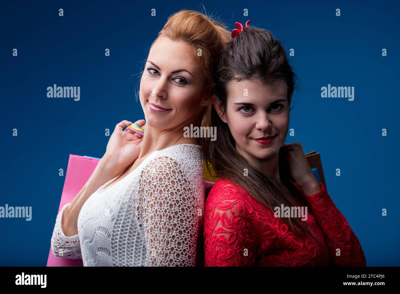 Back-to-back shoppers exude cheer, their shopping success displayed in ...