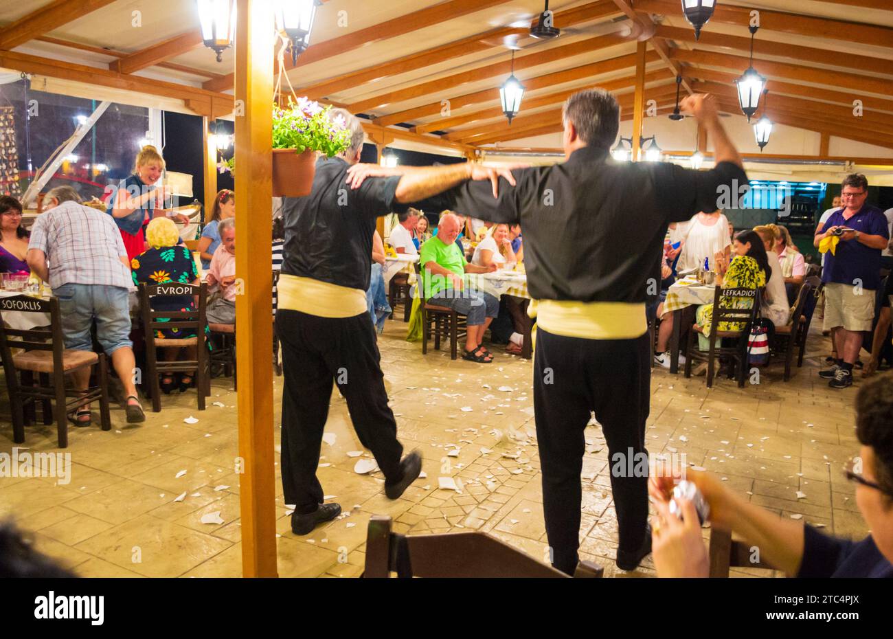 Greek dancers performing traditional dance at a restaurant Nydri ...