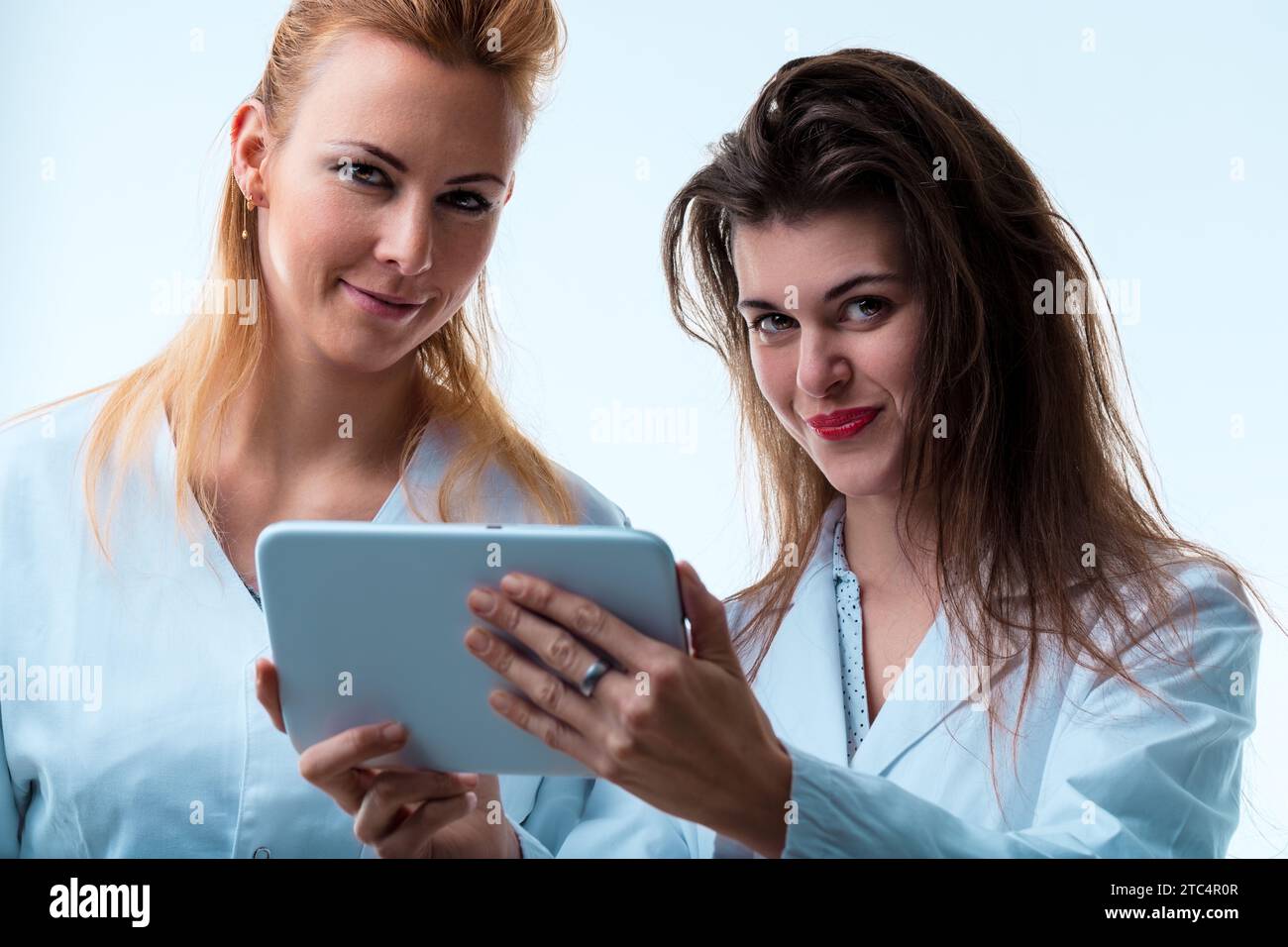 Professional exchange between two doctors reviewing medical information ...