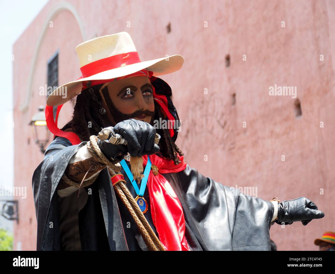 Man with mask and whip from an indigenous Peruvian folk dance group ...