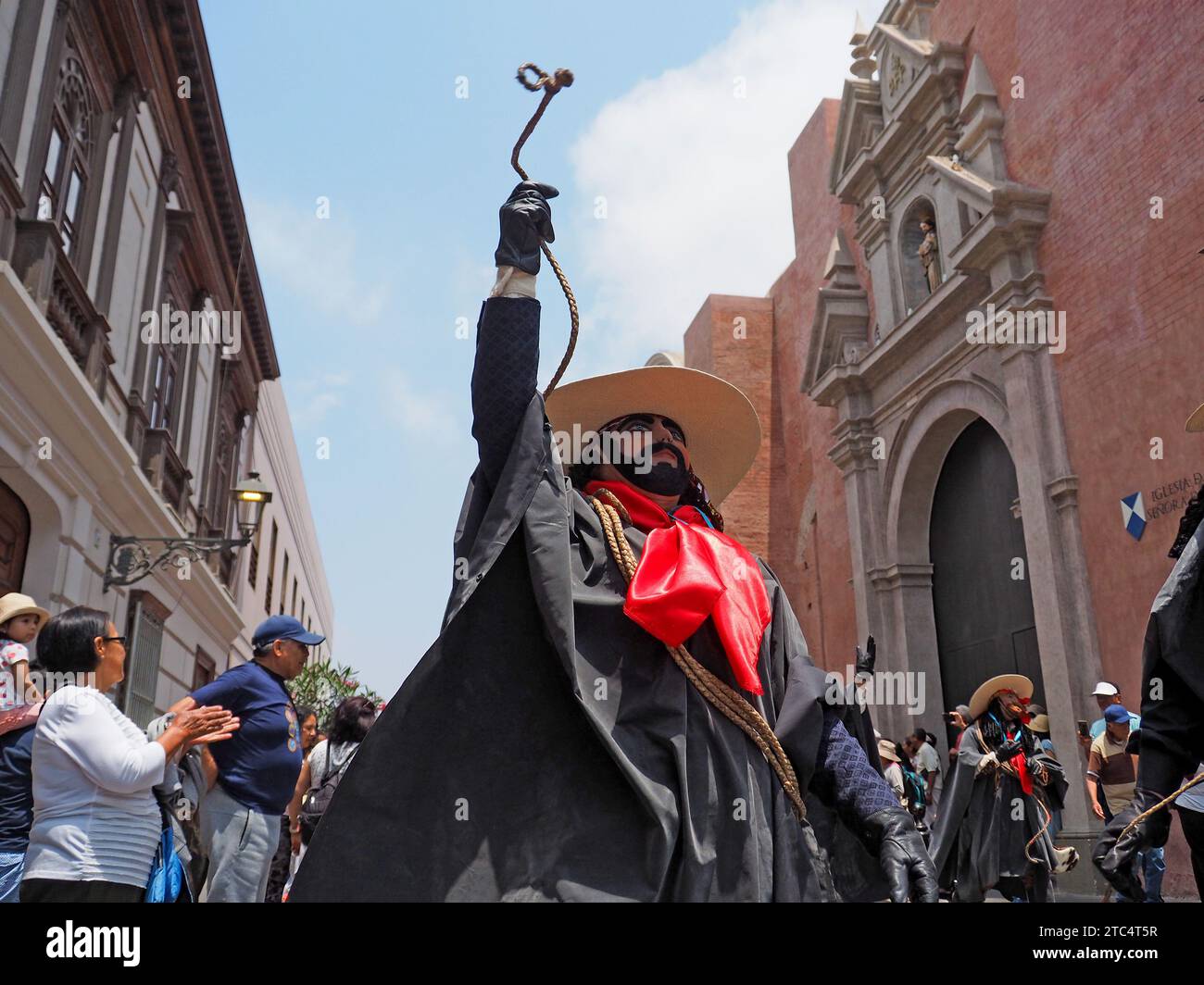 Man with mask and whip from an indigenous Peruvian folk dance group ...