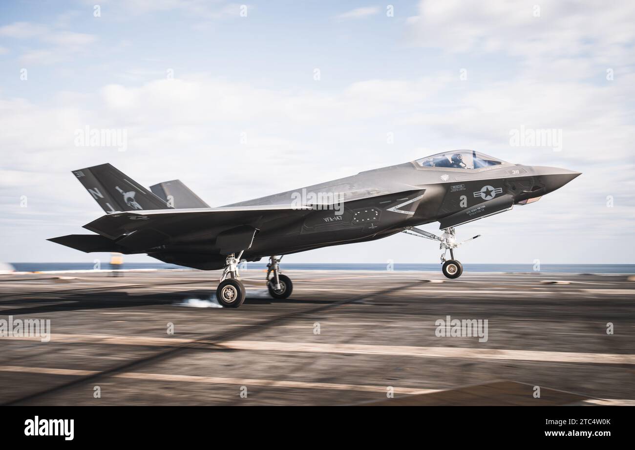 An F-35C Lightning II, from Strike Fighter Squadron (VFA) 147, lands on the flight deck of ...