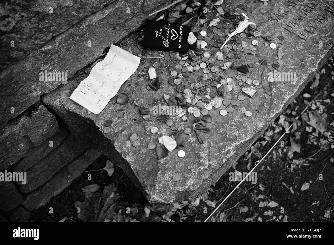 Salem, Massachusetts - Flowers and coins decorate a graveyard monument ...
