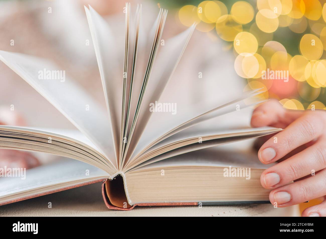 Female hands turn book pages hi-res stock photography and images - Alamy