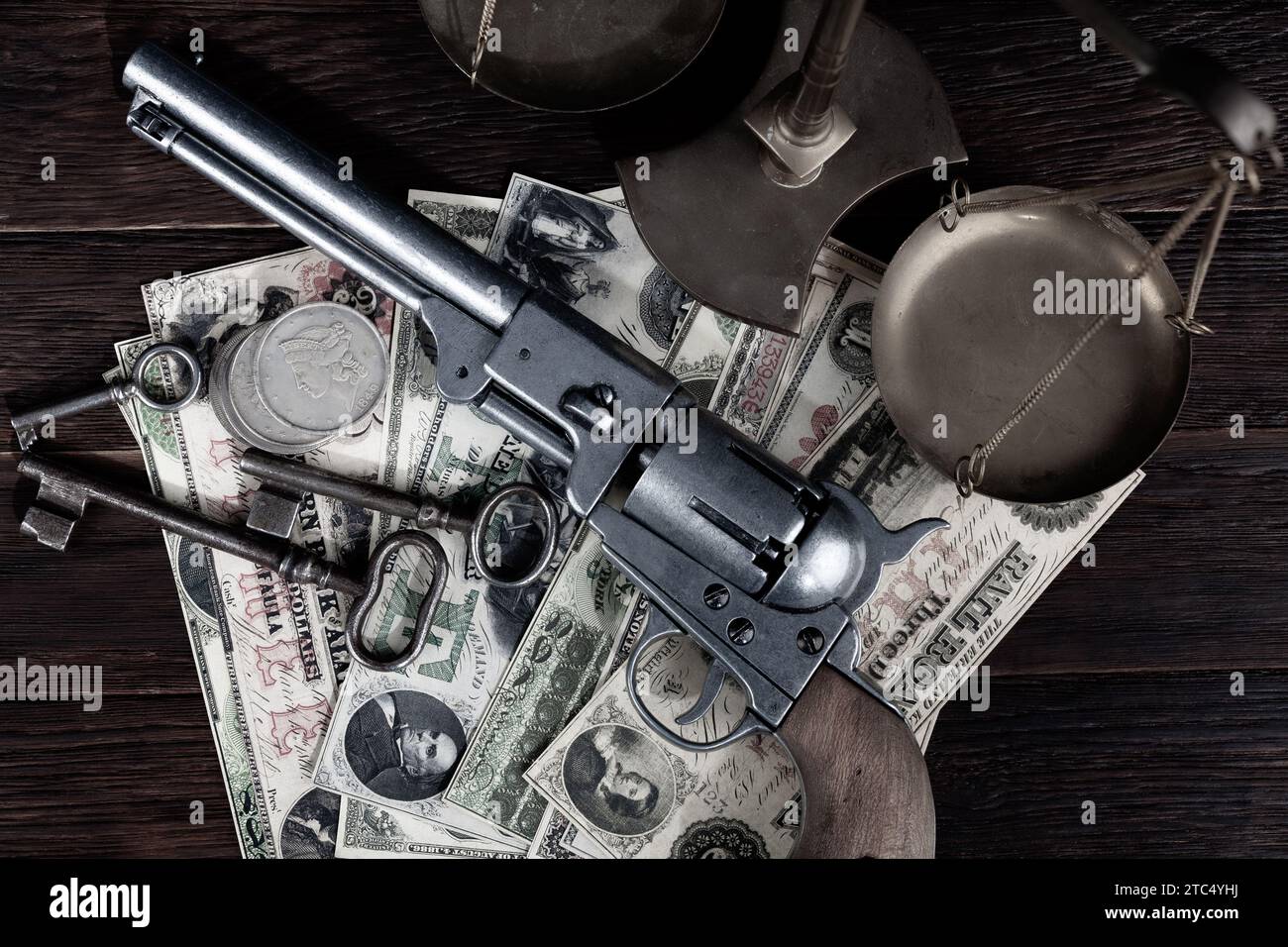 Old west Colt revolver and US banknotes and silver certificates with ...