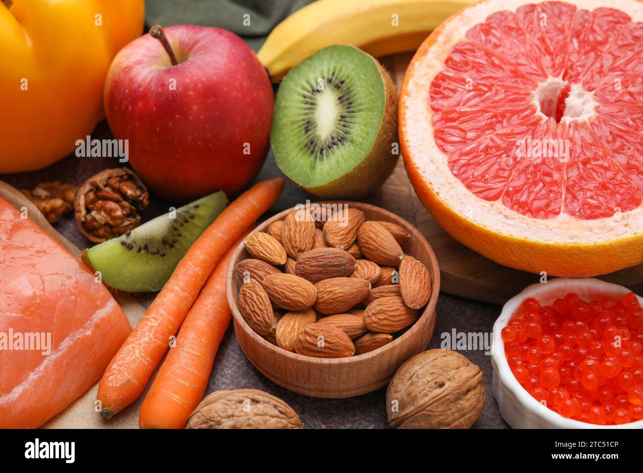 Many different products on brown table, closeup. Natural sources of ...