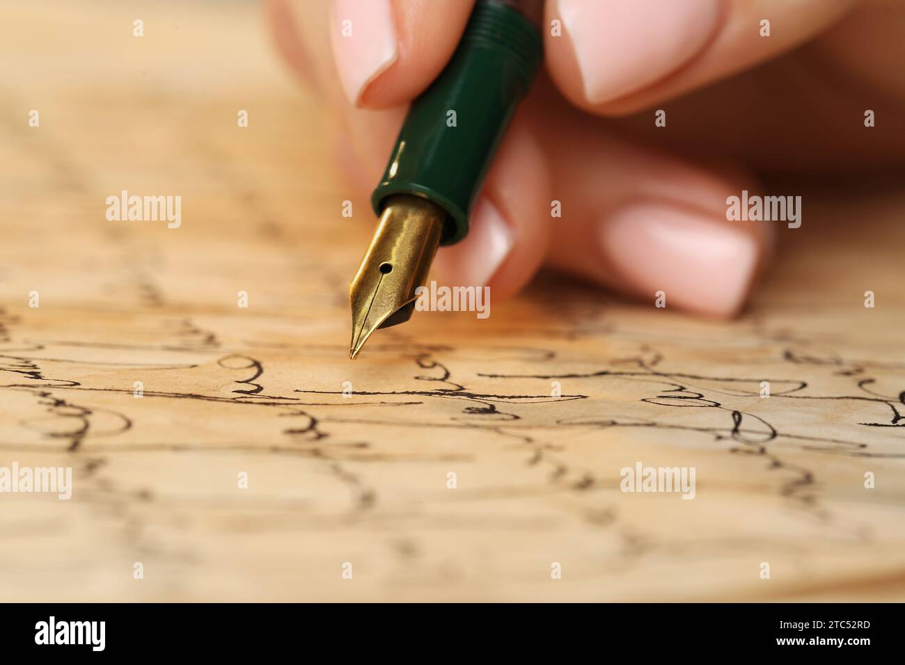 Woman writing letter with fountain pen, closeup Stock Photo - Alamy
