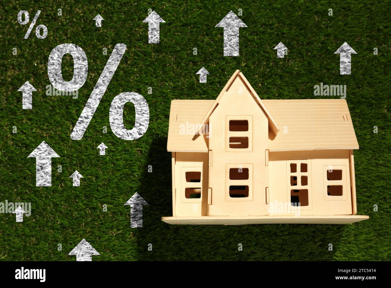 Mortgage rate rising illustrated by upward arrows and percent signs ...