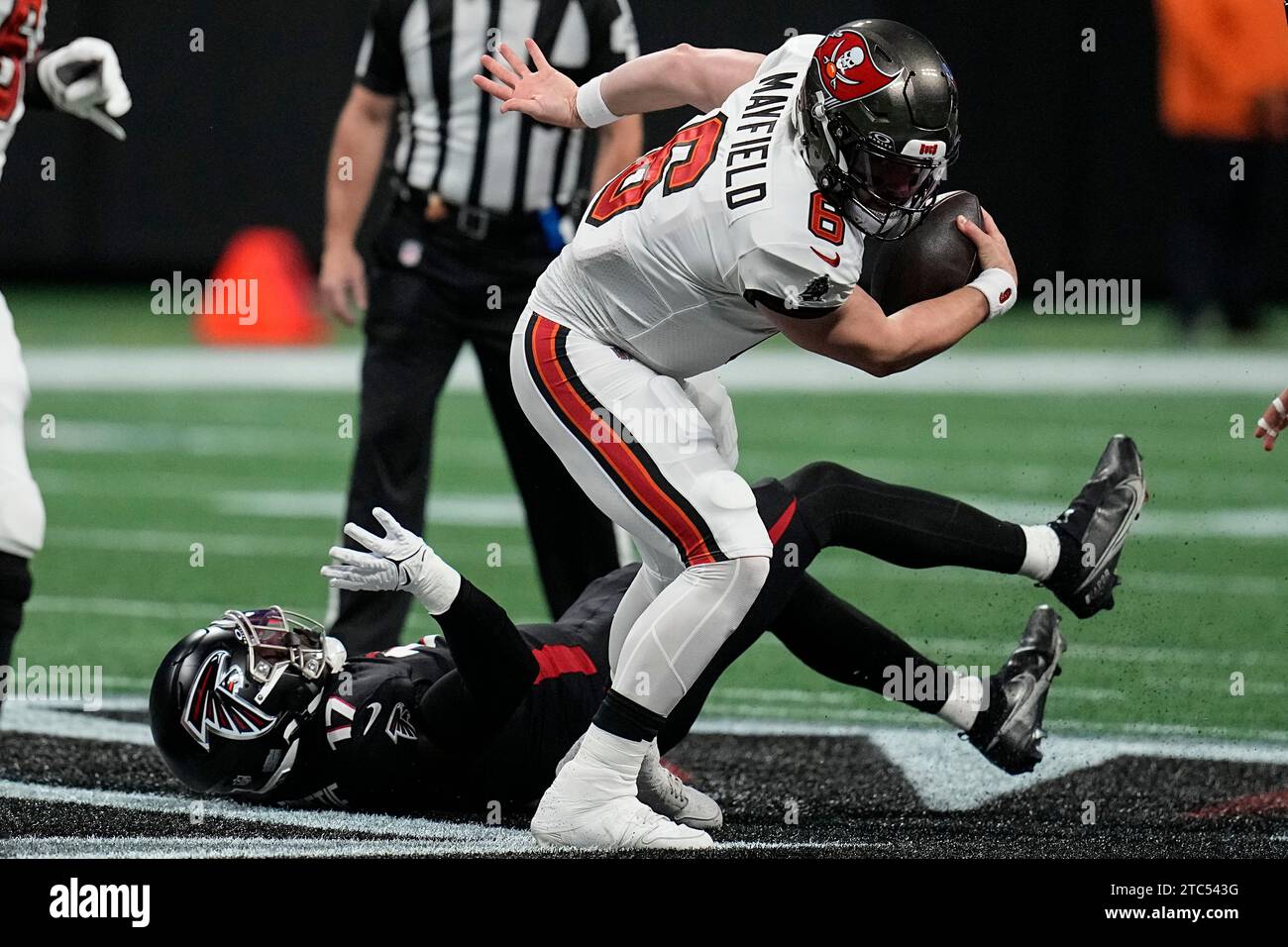 Tampa Bay Buccaneers quarterback Baker Mayfield (6) gets past Atlanta Falcons linebacker Arnold ...