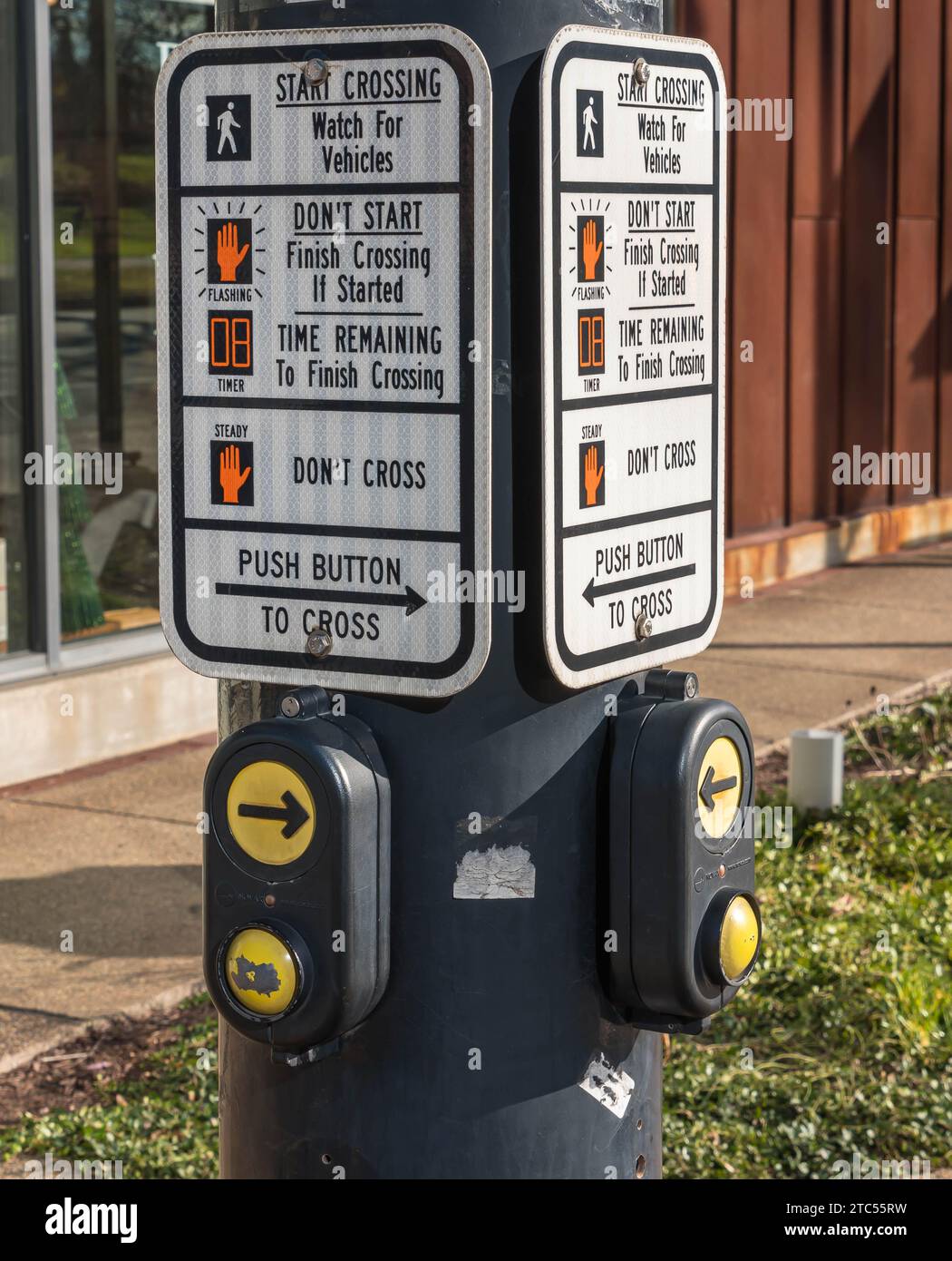 Crosswalk pedestrian sign and buttons on a pole on Penn Avenue in ...