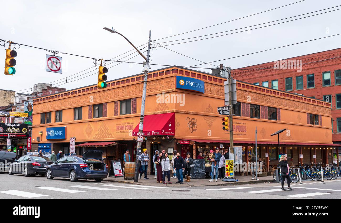 People outside of a building on Penn Avenue in the Strip District ...