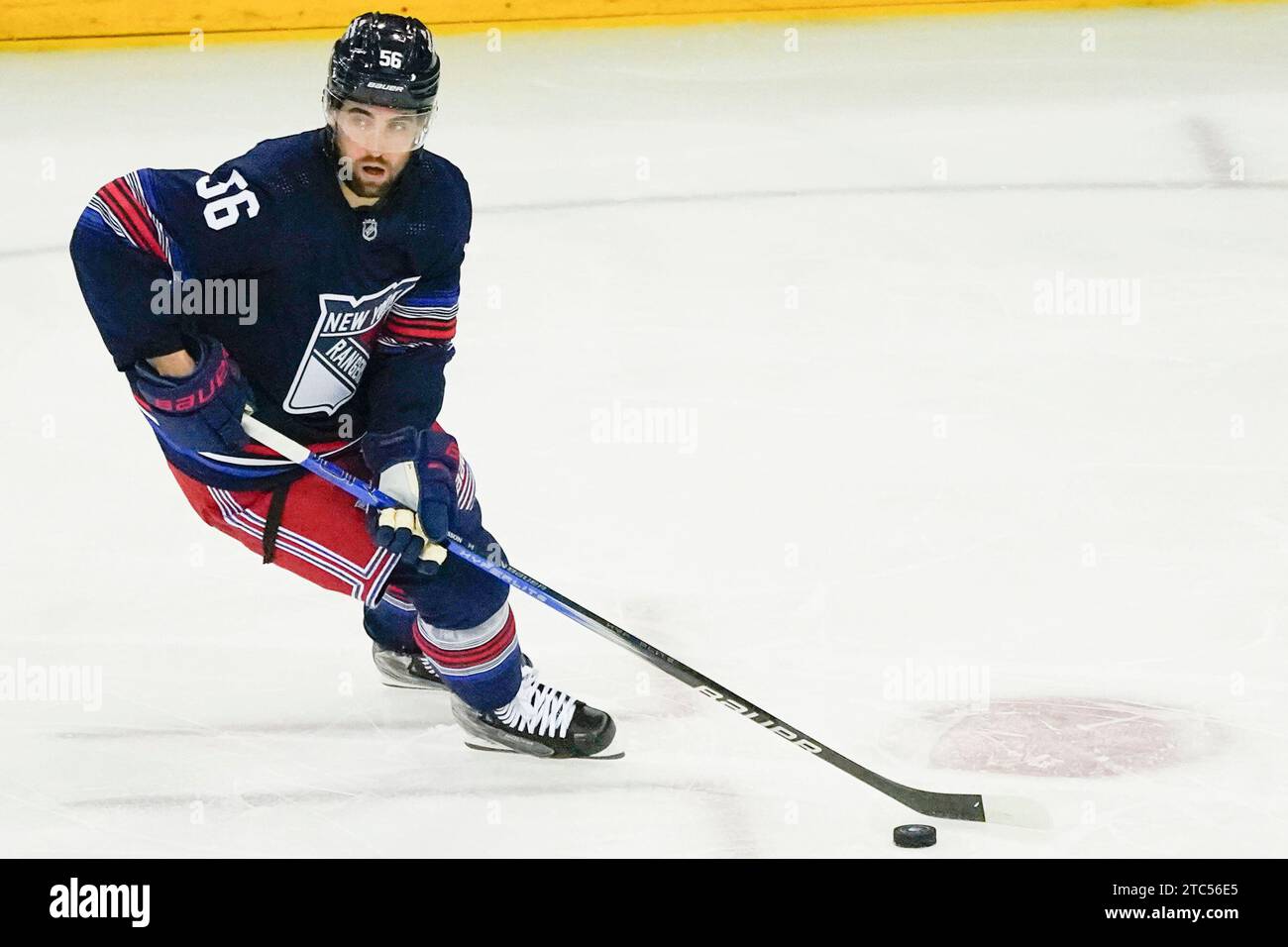 New York Rangers defenseman Erik Gustafsson looks to pass the puck ...
