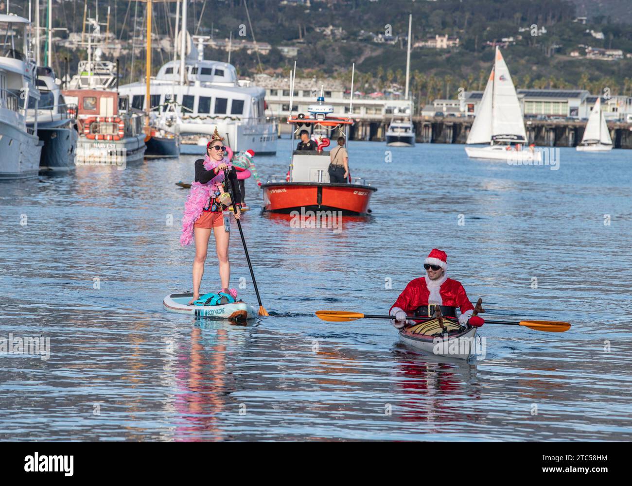 Santa Barbara, California, USA. 10th Dec, 2023. Santa, his elves and other holiday revelers ...