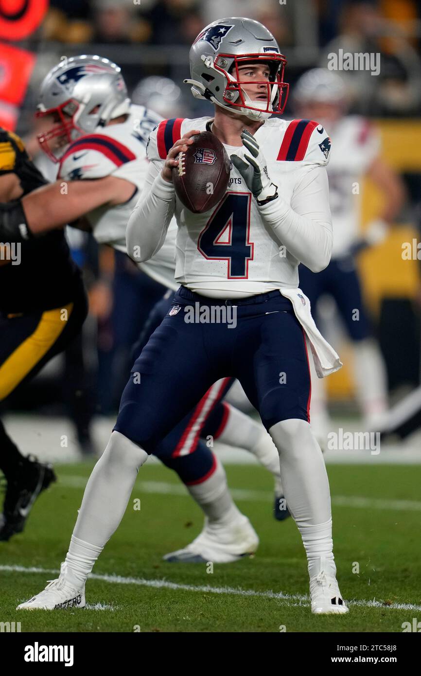 New England Patriots quarterback Bailey Zappe (4) throws a pass during ...