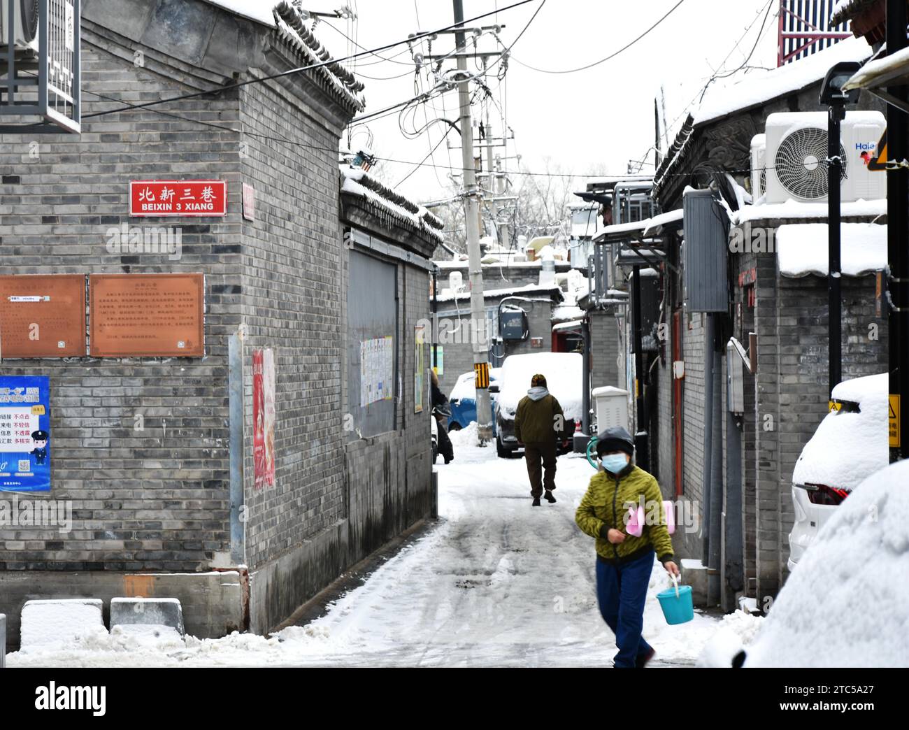 BEIJING, CHINA - DECEMBER 11, 2023 - People brave snow on Guozijian ...