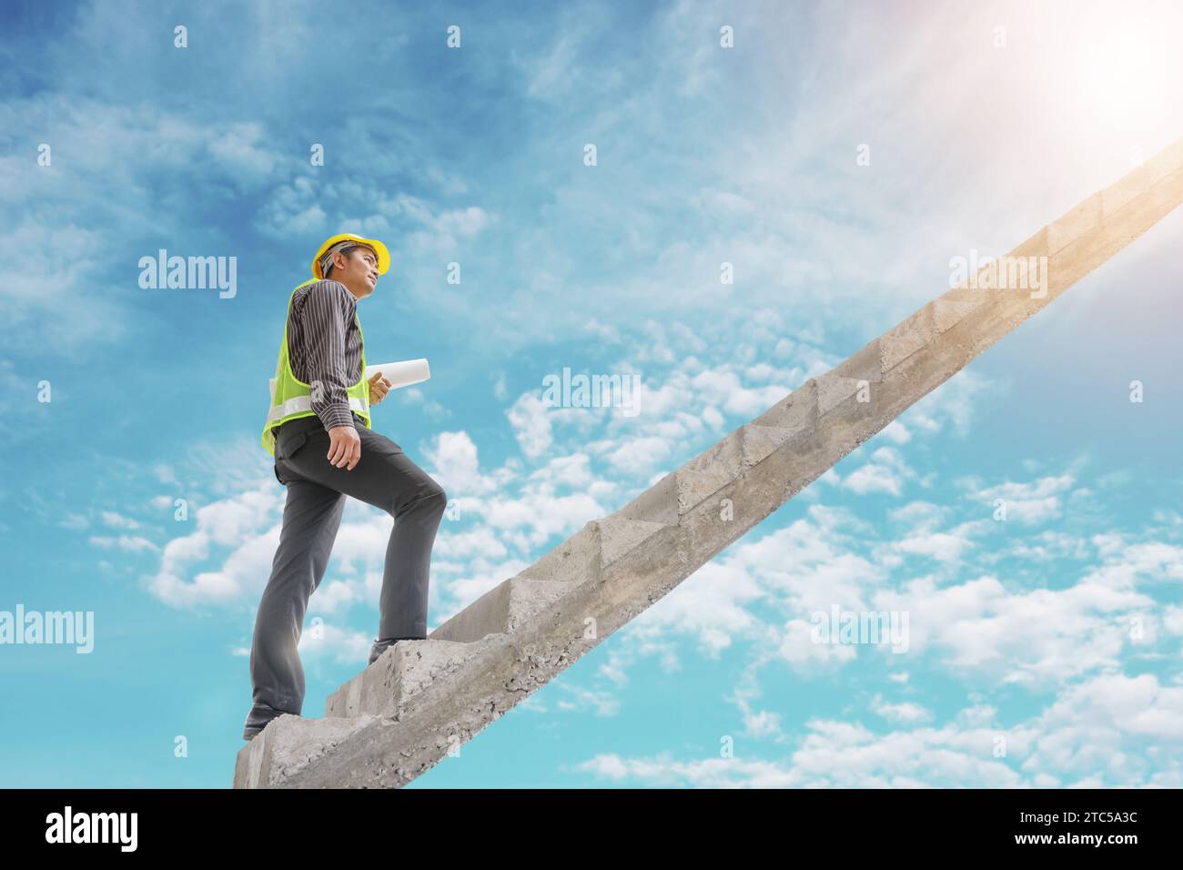 Asian business man construction engineer hold blueprint paper walking ...