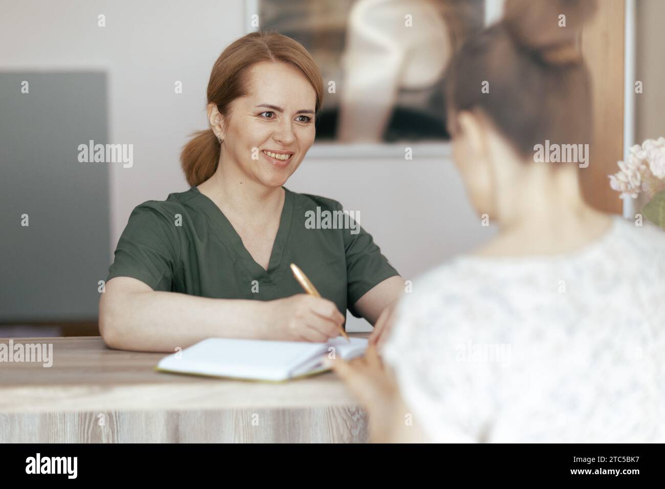 Healthcare Time Smiling Female Medical Massage Therapist In Massage